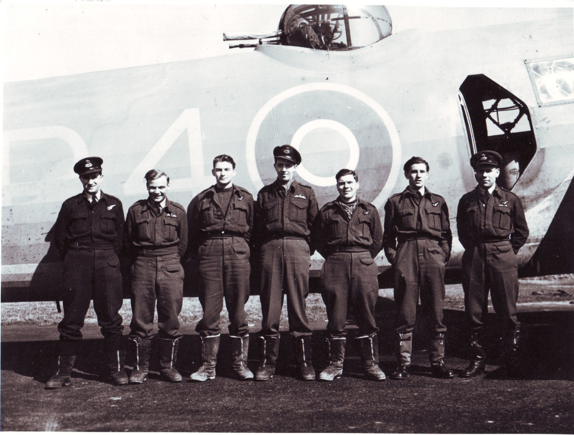 seven RAF men stand outside an aeroplane on Mullaghmore airfield ...
