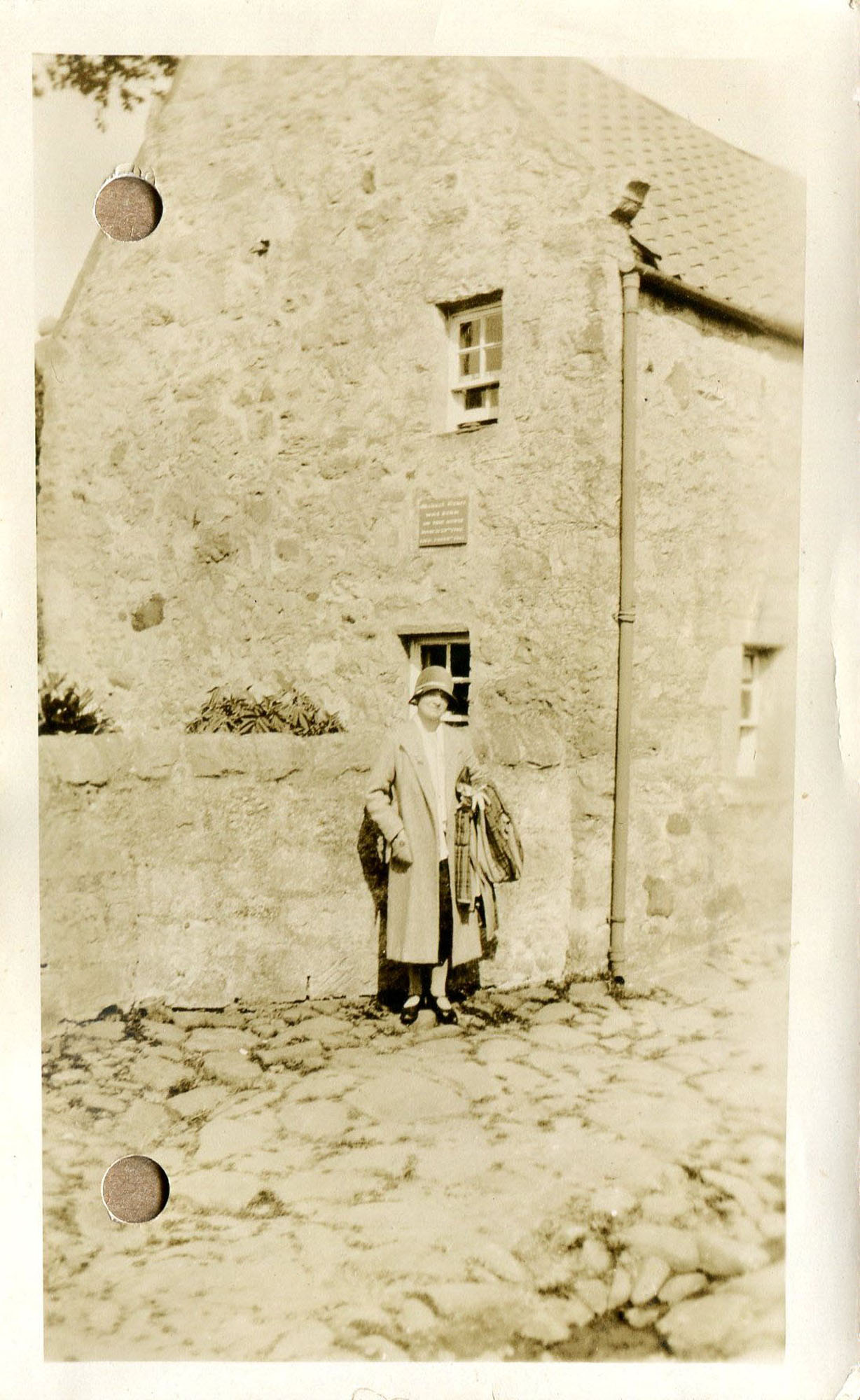 Photograph of Anna Smart outside birthplace of Scottish poet Michael ...